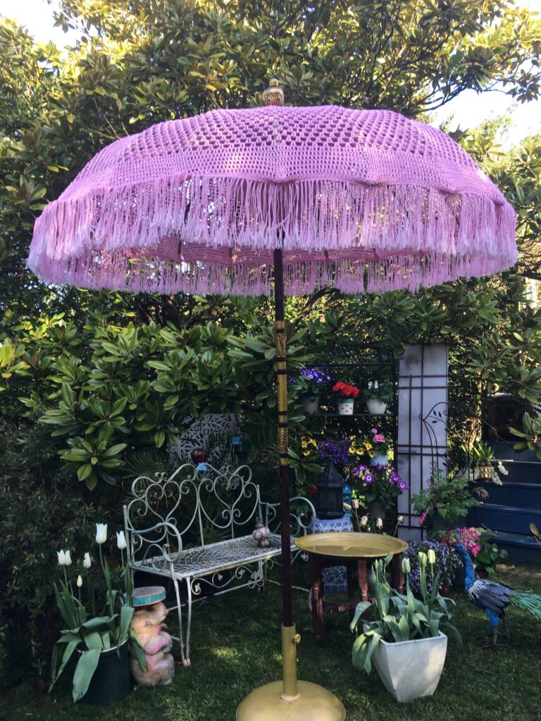 Pink woven macrame umbrella