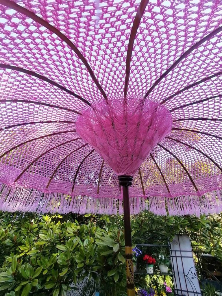 Pink woven macrame umbrella